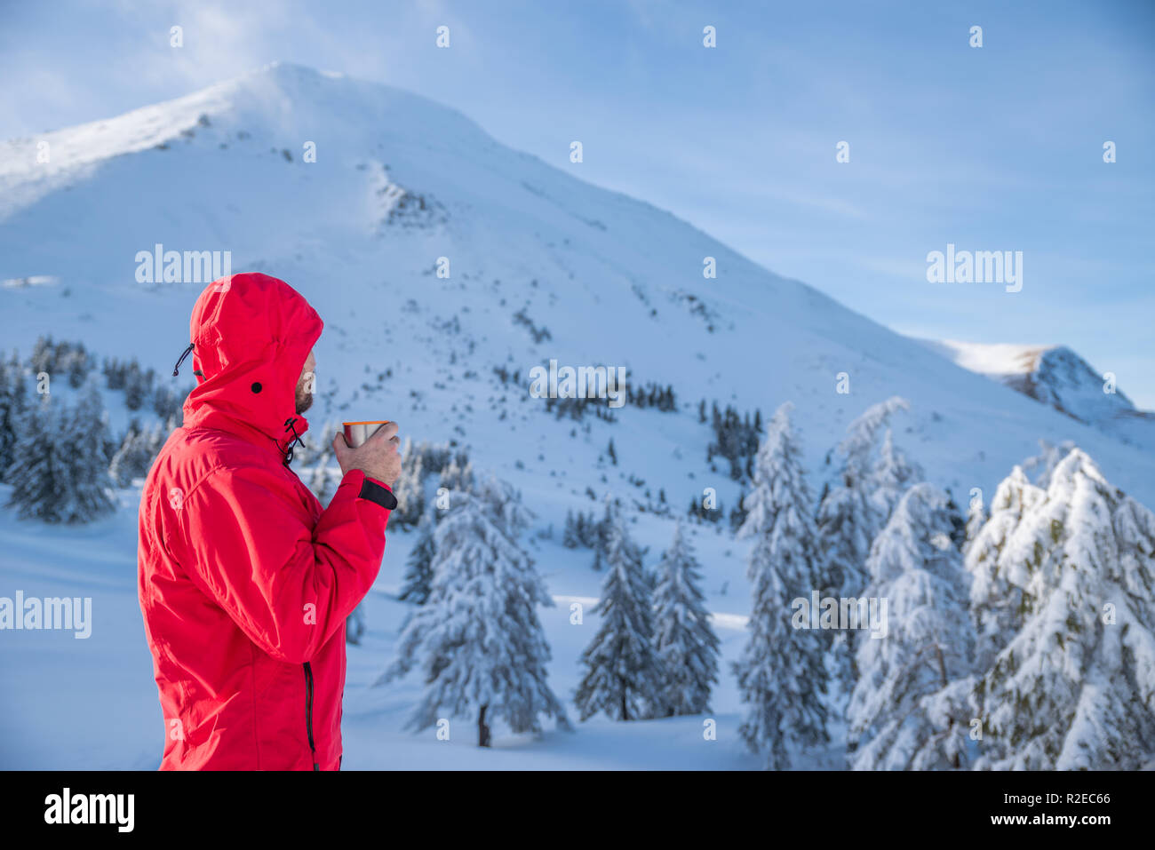 Winter hiking. Tourists are hiking in the snow-covered mountains ...