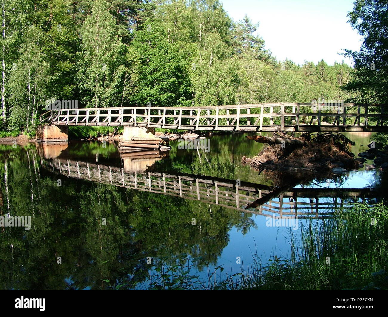 wooden bridge with bend Stock Photo - Alamy