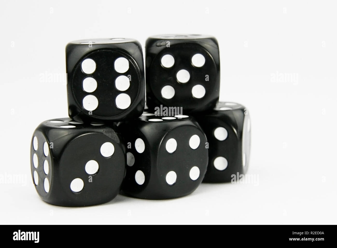 Five black cubic dice on white background Stock Photo - Alamy