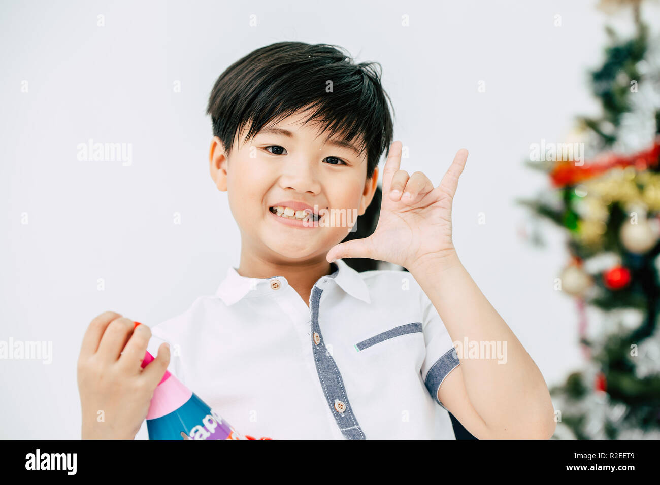 Asian boy smile happy handsome model closeup action in the studio ...