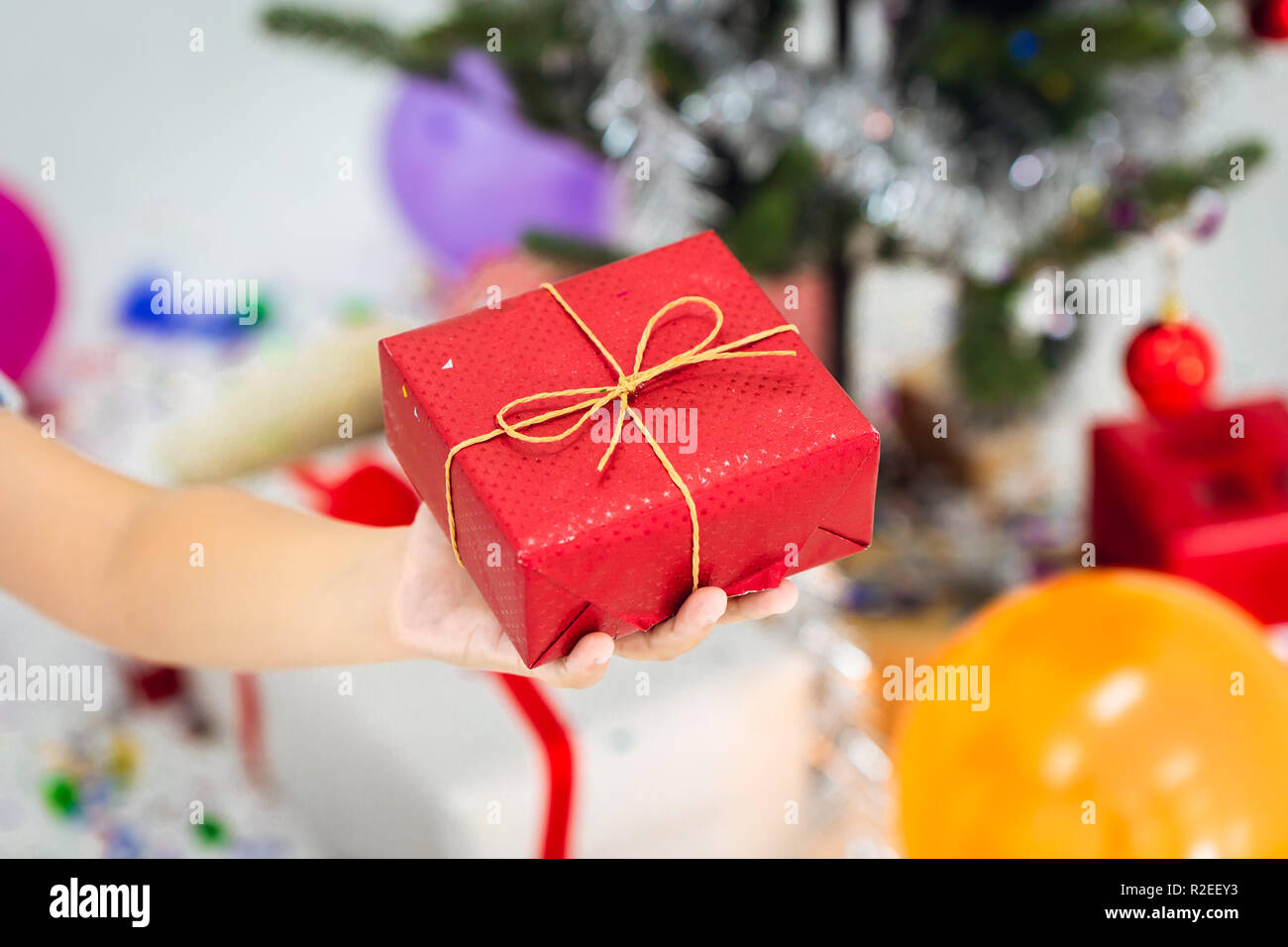 children hand holding present gift box Stock Photo - Alamy