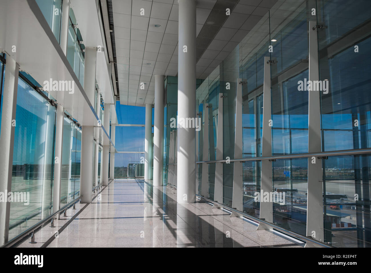 Empty Airport Hall with Glass Windows and White Column. Blue Sky ...