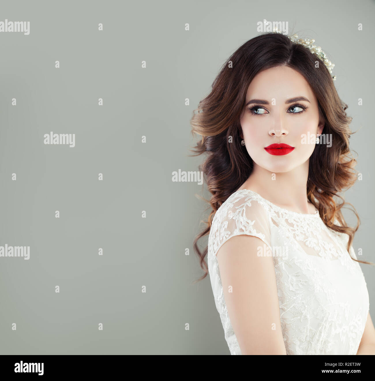 Perfect young woman bride with trendy makeup and bridal hairstyle ...