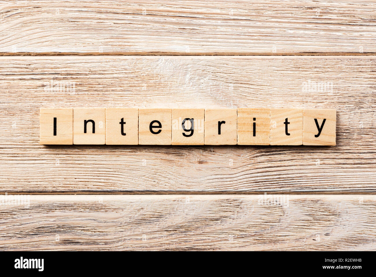 integrity word written on wood block. integrity text on table, concept ...