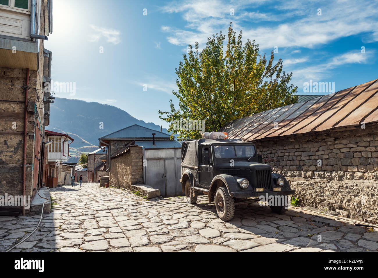 Retro car in old town Stock Photo - Alamy