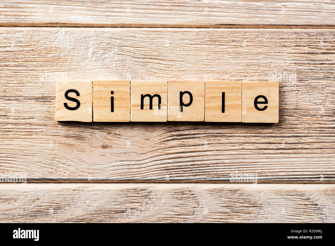 simple word written on wood block. simple text on table, concept Stock ...