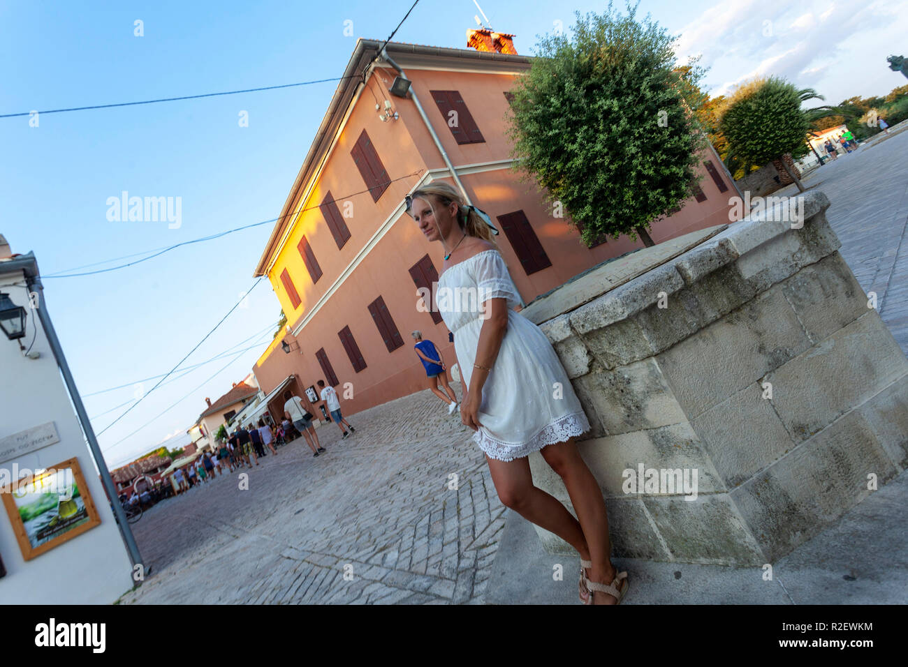 Girl in white dress in Nin, Croatia Stock Photo - Alamy