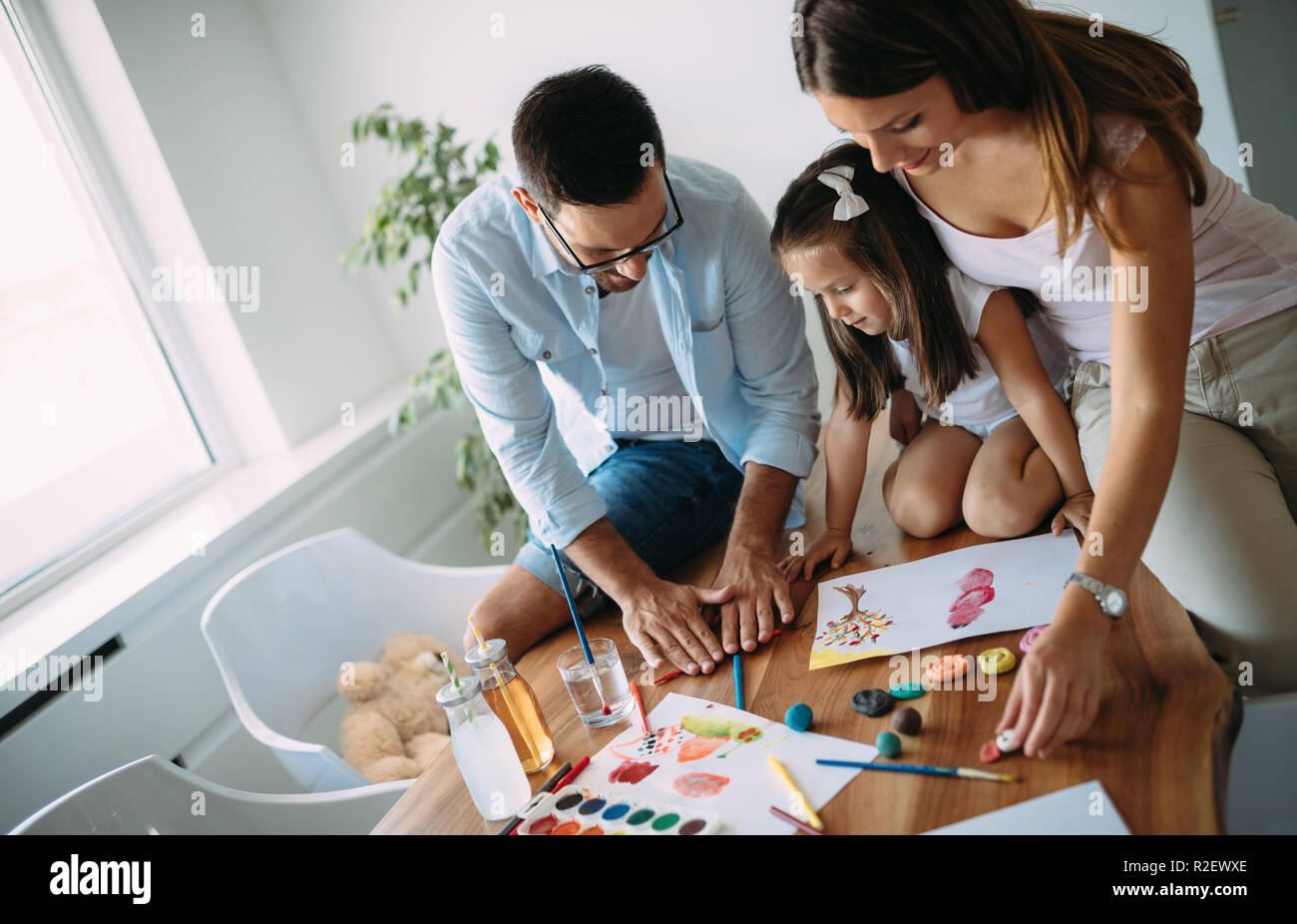 Happy family having fun time at home Stock Photo - Alamy