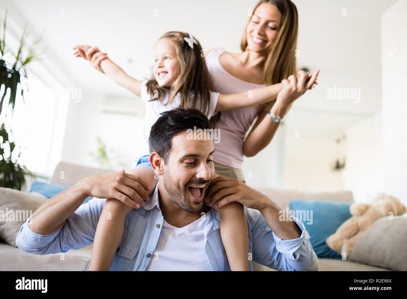 Happy family having fun time at home Stock Photo - Alamy