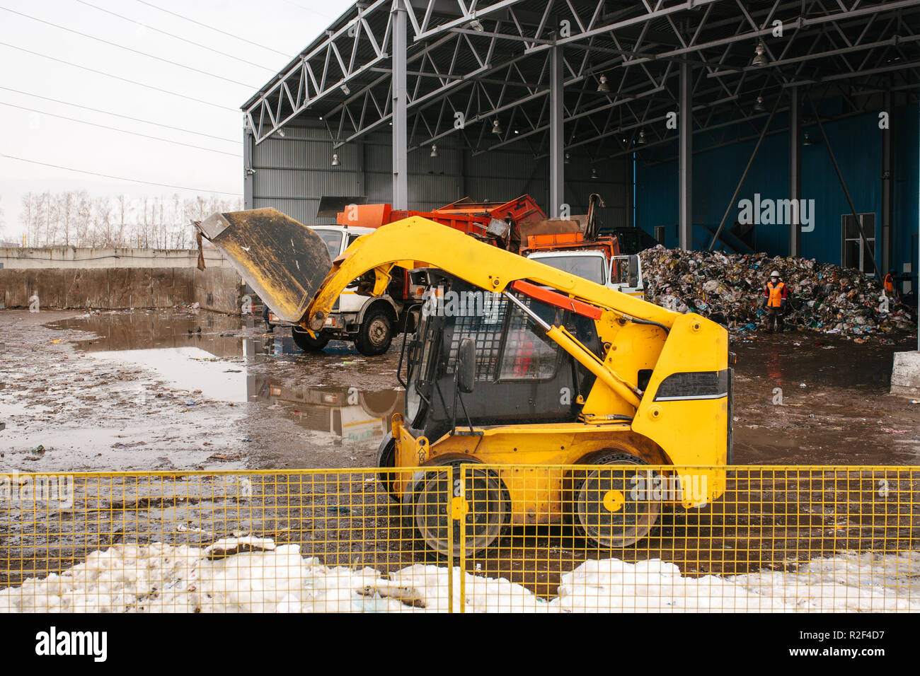 Special machinery or bulldozer work on the site of waste unloading at ...