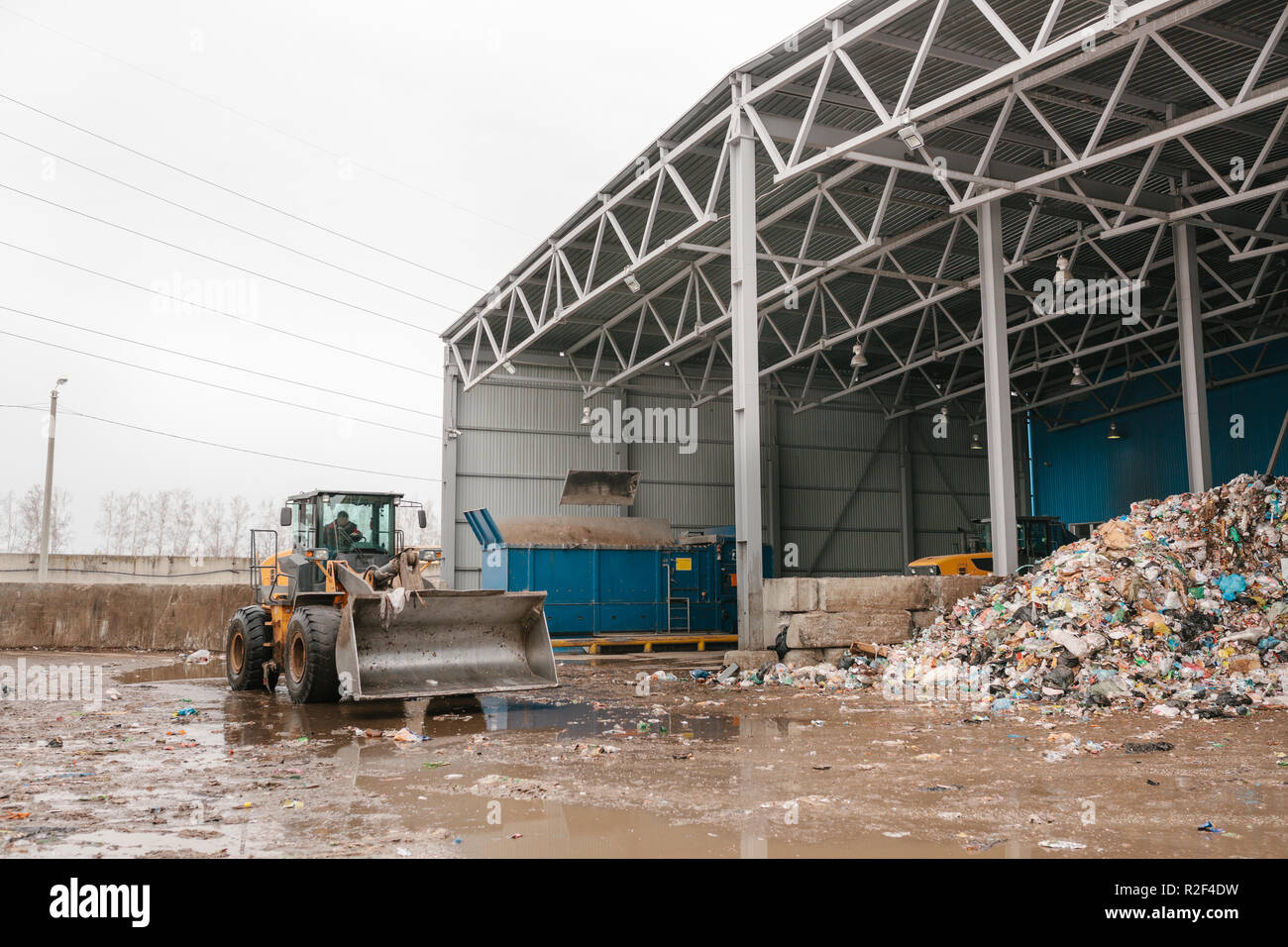 Special machinery or bulldozer work on the site of waste unloading at ...