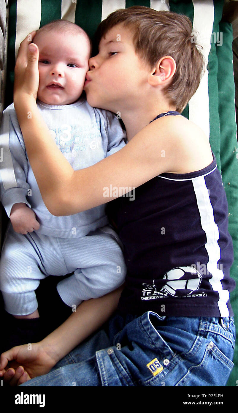 Brotherly kiss hi-res stock photography and images - Alamy