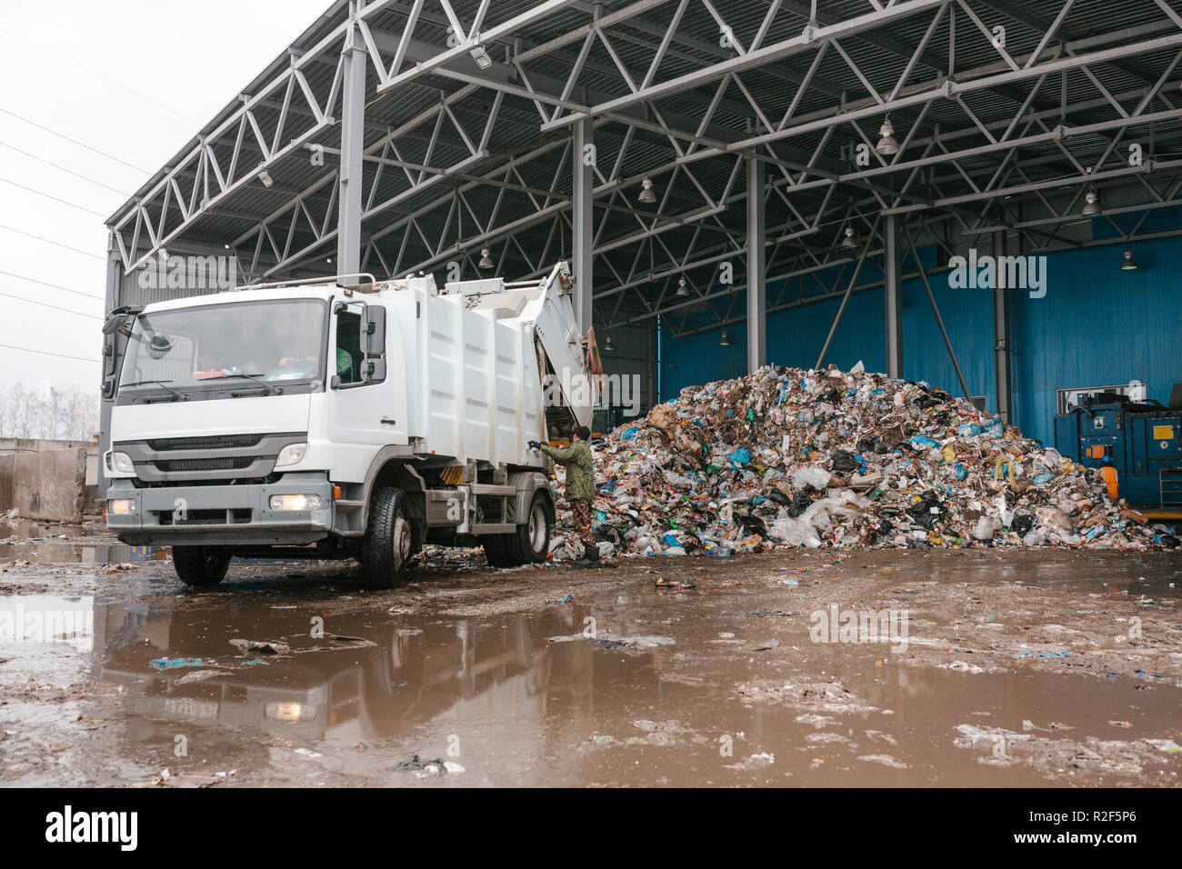 A special machine unloads waste to the storage area at the waste ...