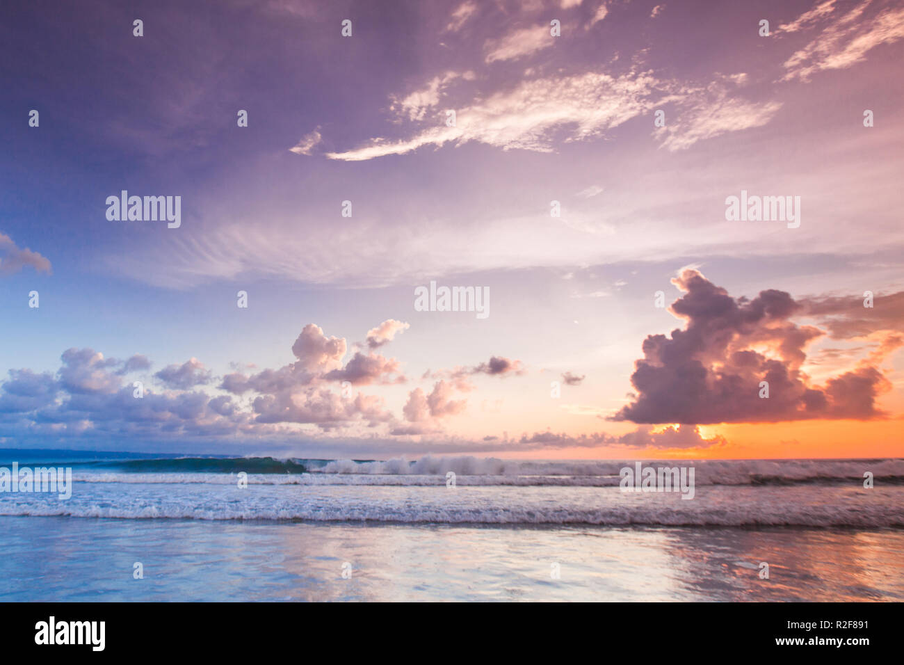Radiant colorful sea beach sunset on Bali, Indonesia Stock Photo - Alamy