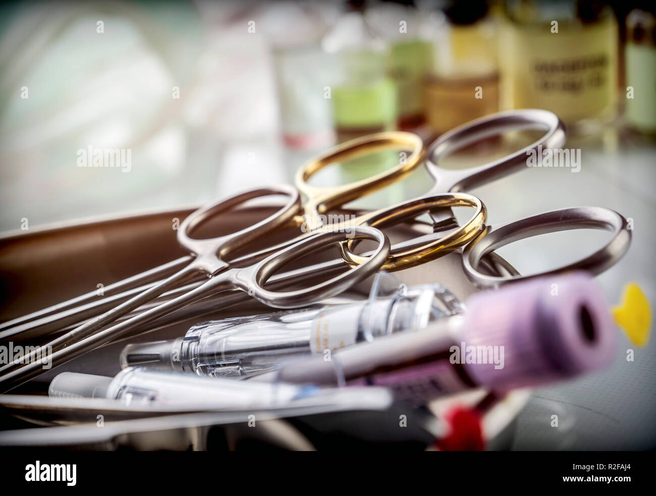 Several vials and scissors of suture in a laboratory in a hospital ...