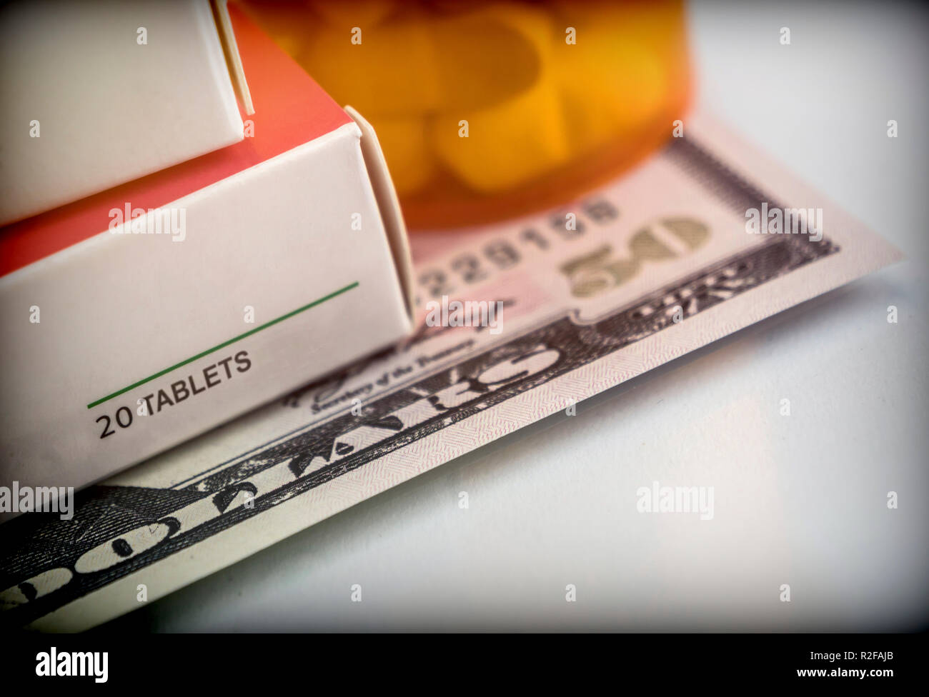 Box of medications 20 tablets on a ticket of dollar, conceptual image ...