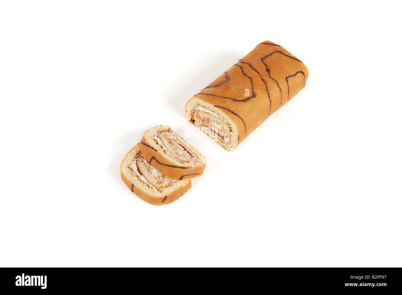 Biscuit roll cut into pieces, on a white background Stock Photo - Alamy