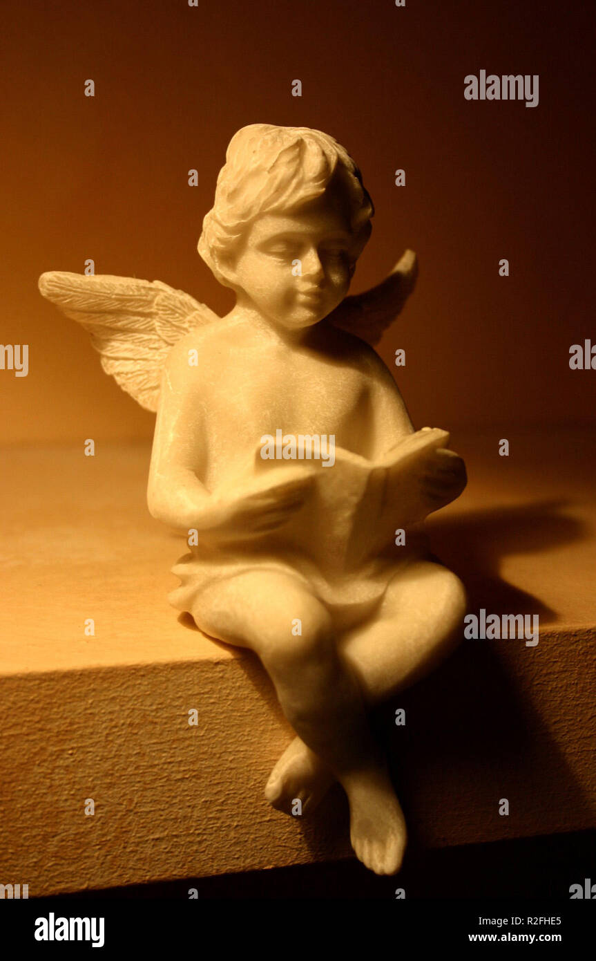 Reading angels sitting hi-res stock photography and images - Alamy