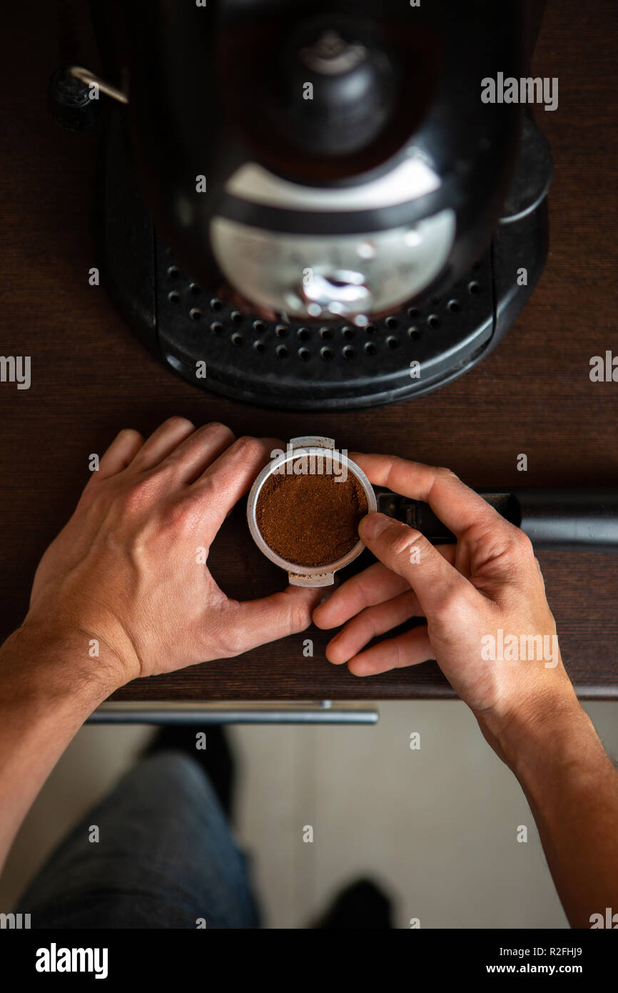Photo of coffee maker, man hand pouring coffee Stock Photo - Alamy