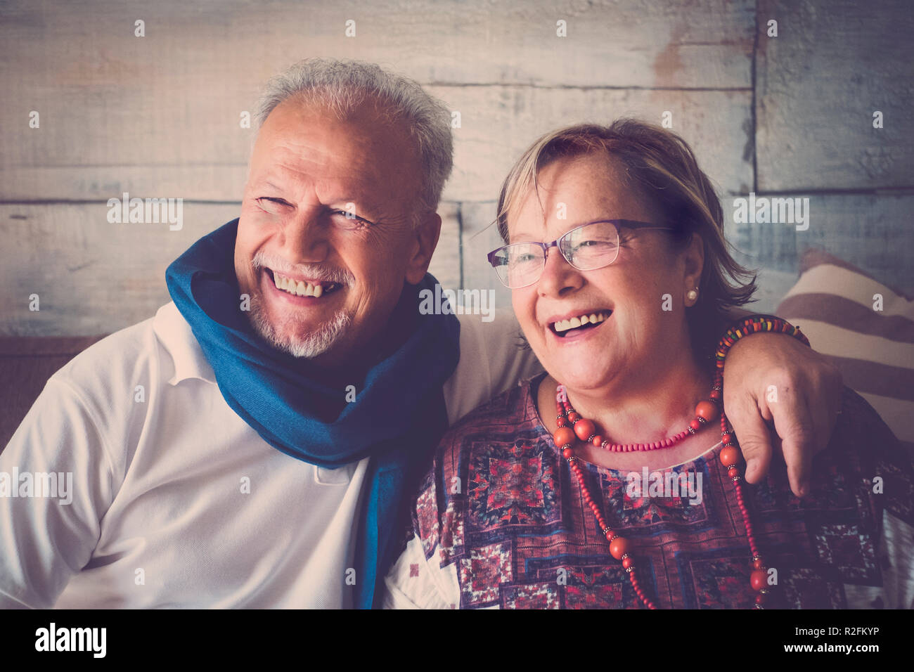 senior gentleman and lady smile and have fun at home with love ...