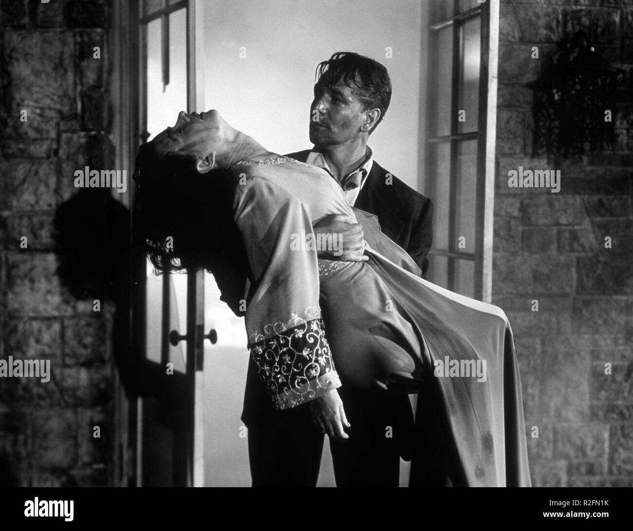 Guy Carrying Limp Girl In Arms