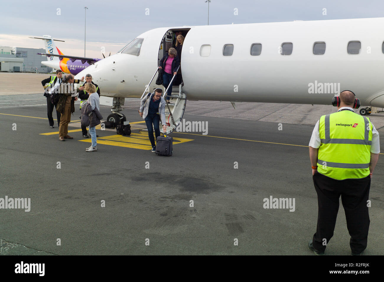 People disembarking from unmarked aircraft at Bristol Airport Stock ...
