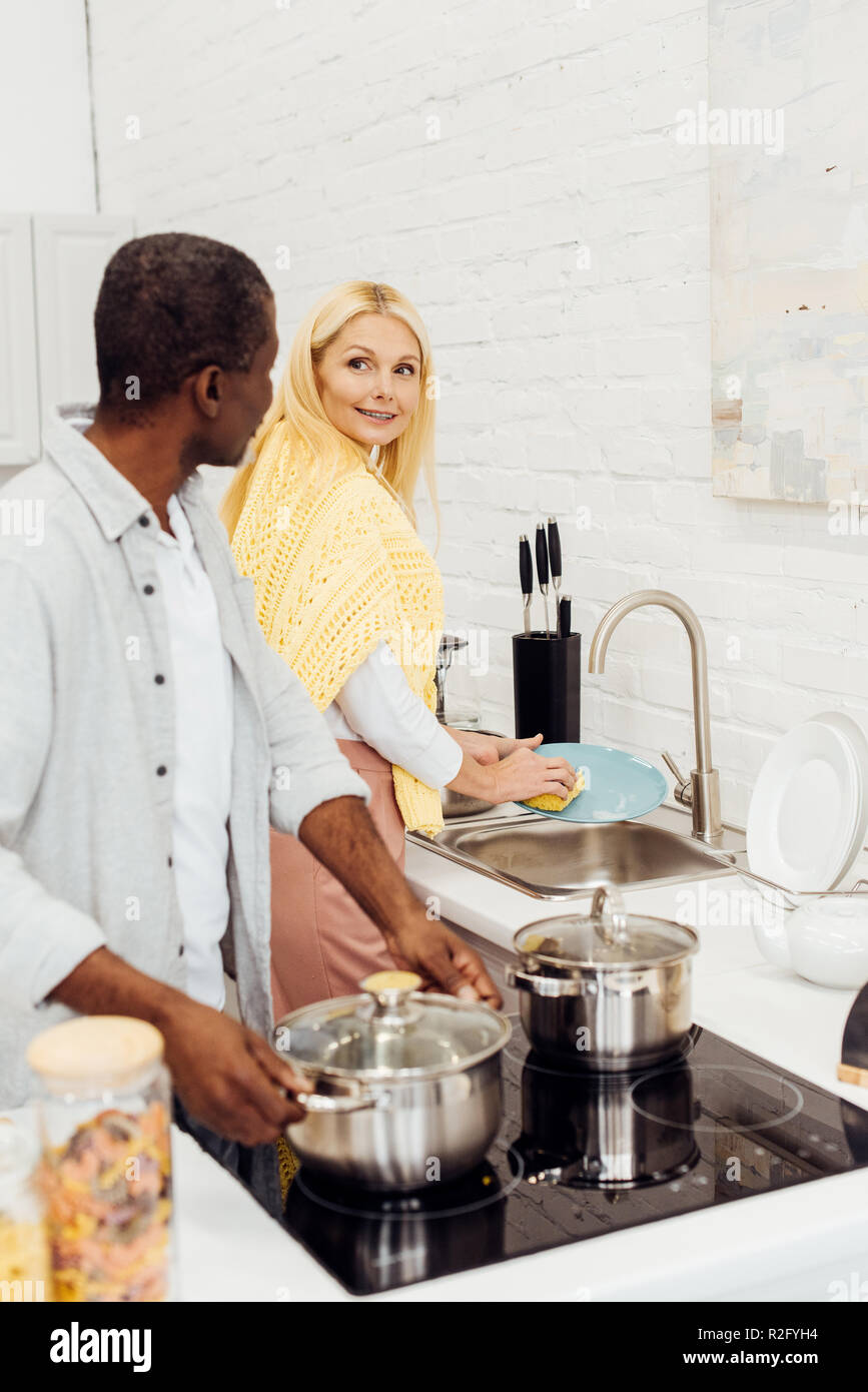 Woman cooking pot cleaning hi-res stock photography and images - Alamy