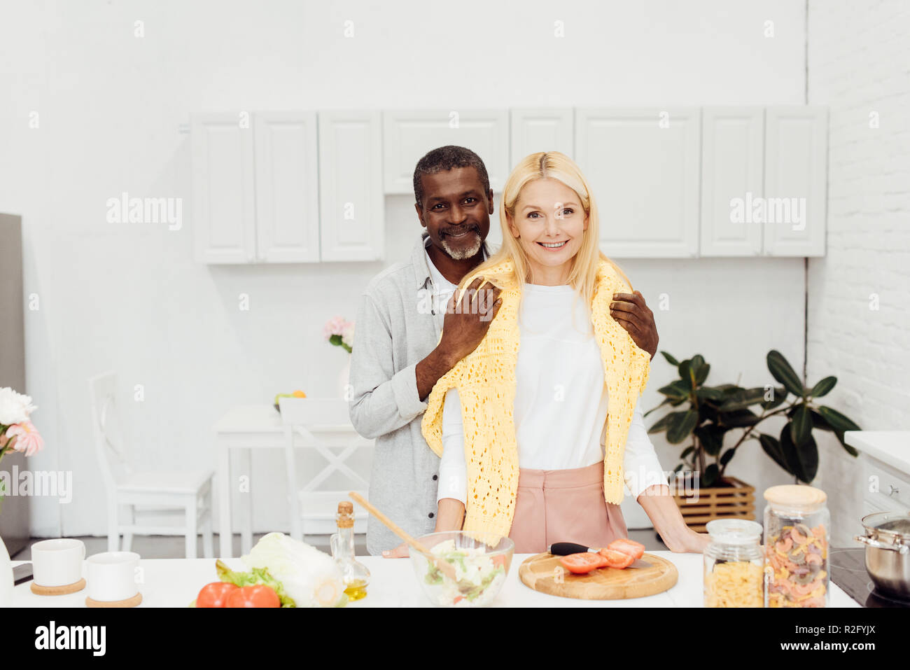 Multiethnic family couple cooking dinner hi-res stock photography and ...