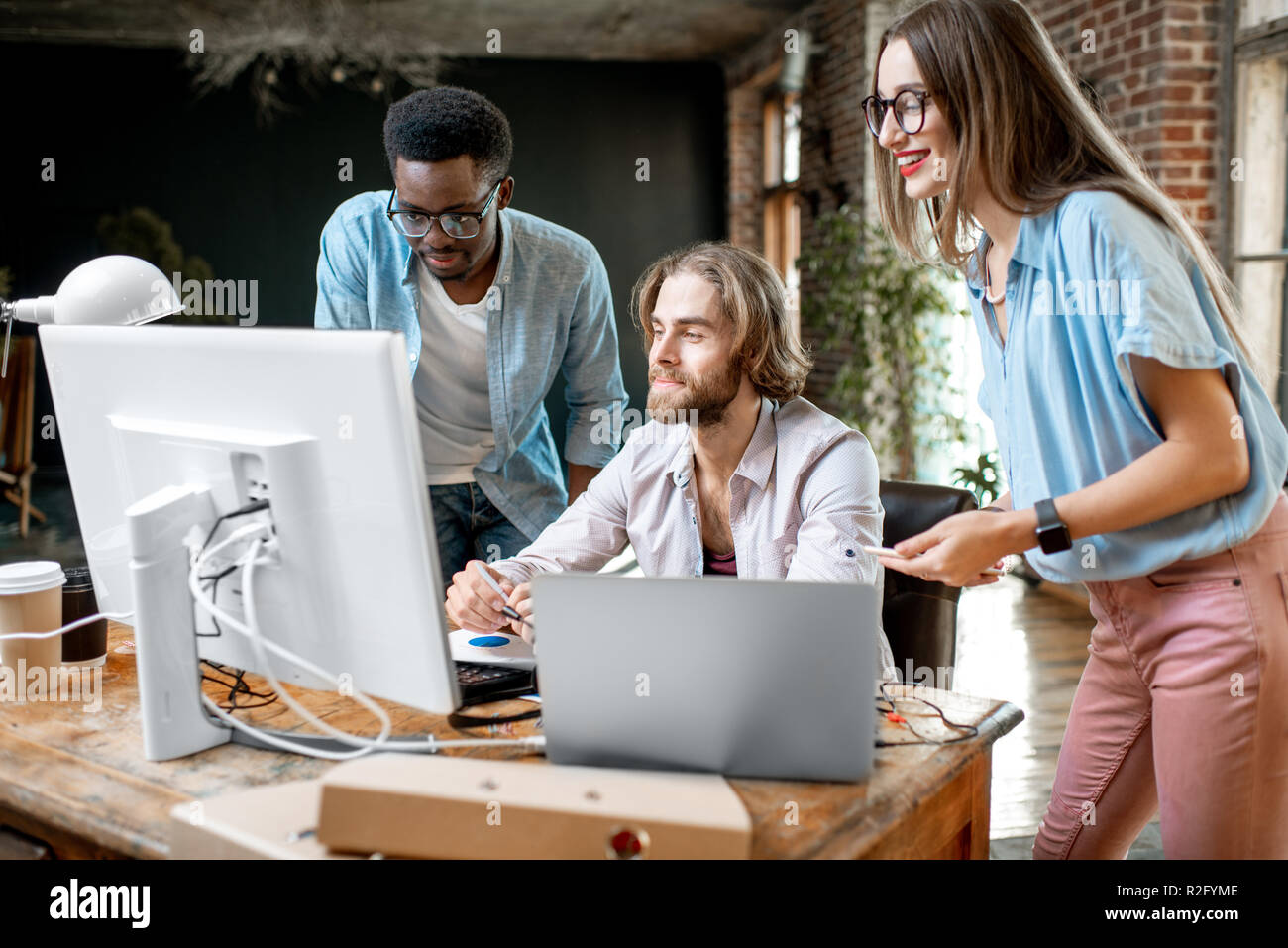 Group of young multi ethnicity coworkers dressed casually working ...