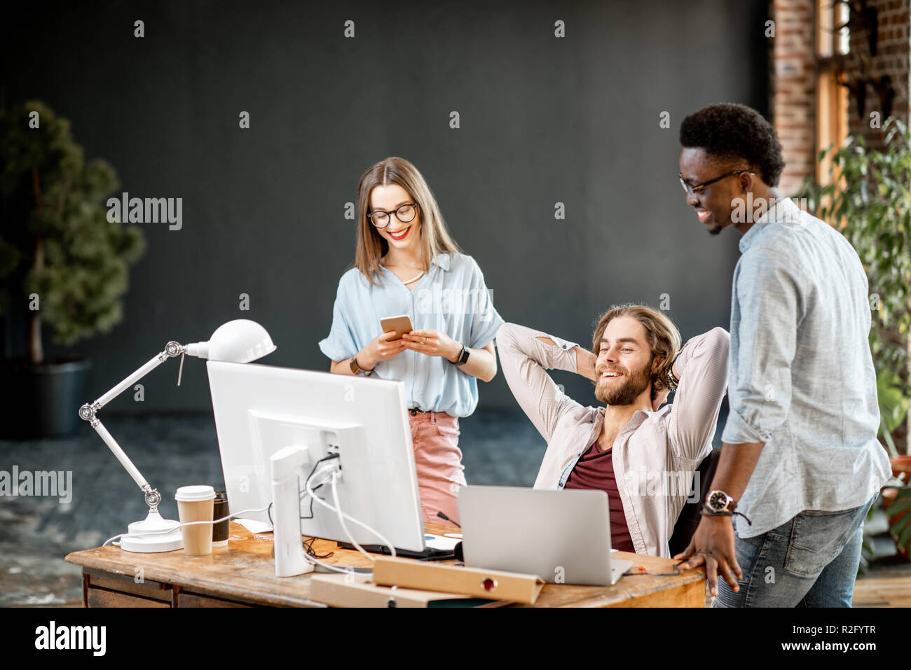 Group of young multi ethnicity coworkers dressed casually working ...