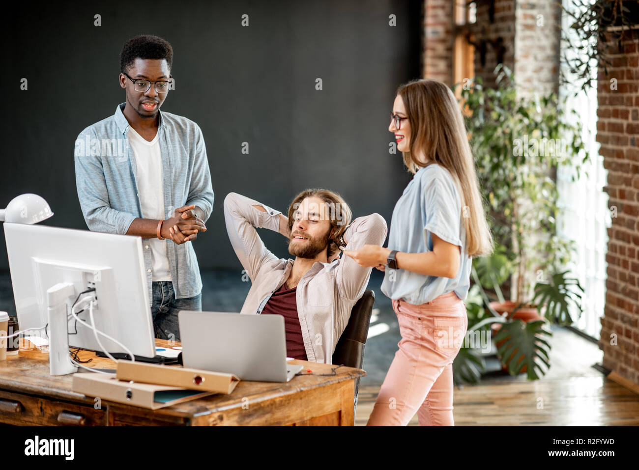 Group of young multi ethnicity coworkers dressed casually working ...