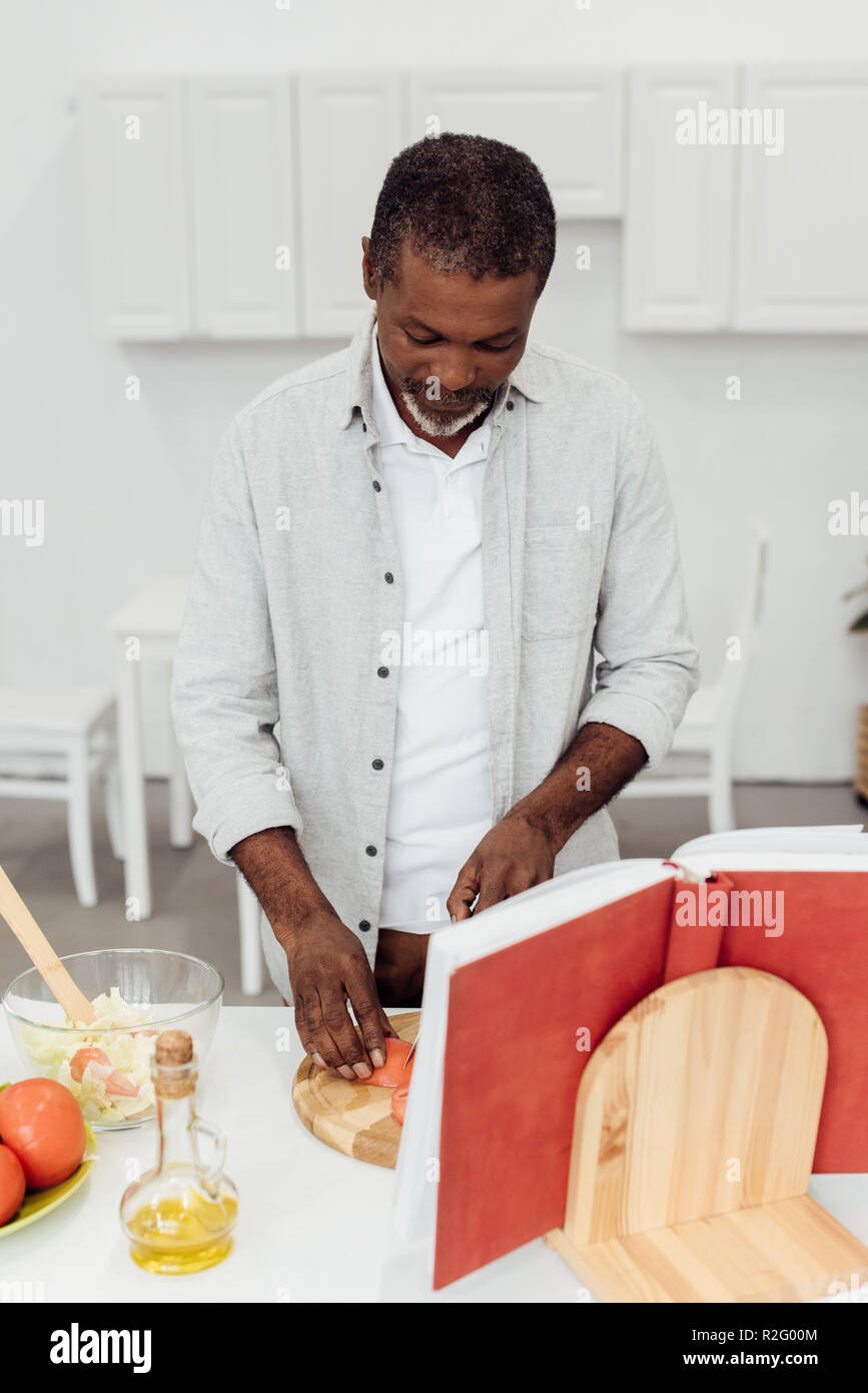 Mature black man cooking kitchen hi-res stock photography and images ...
