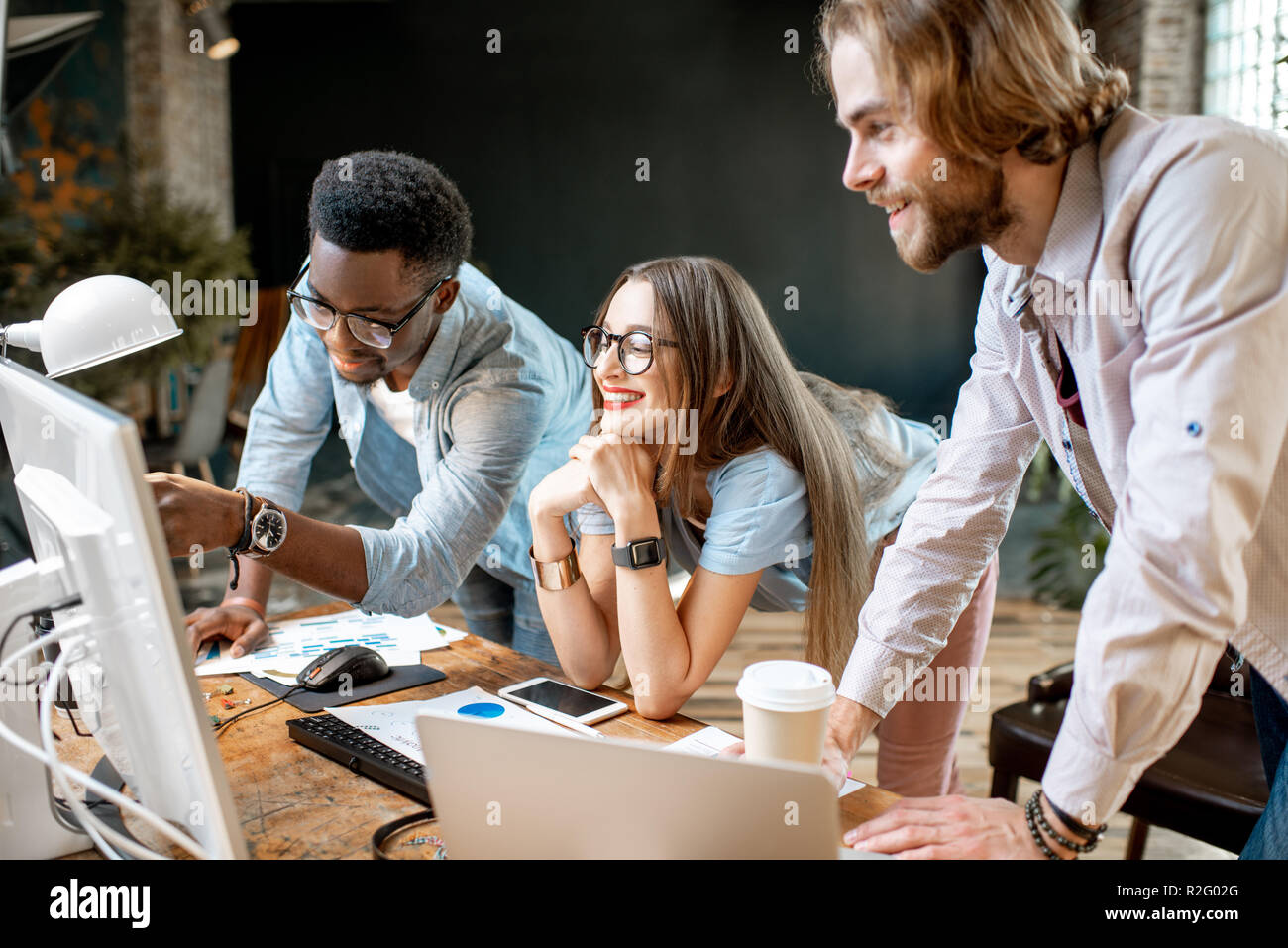 Group of young multi ethnicity coworkers dressed casually working ...