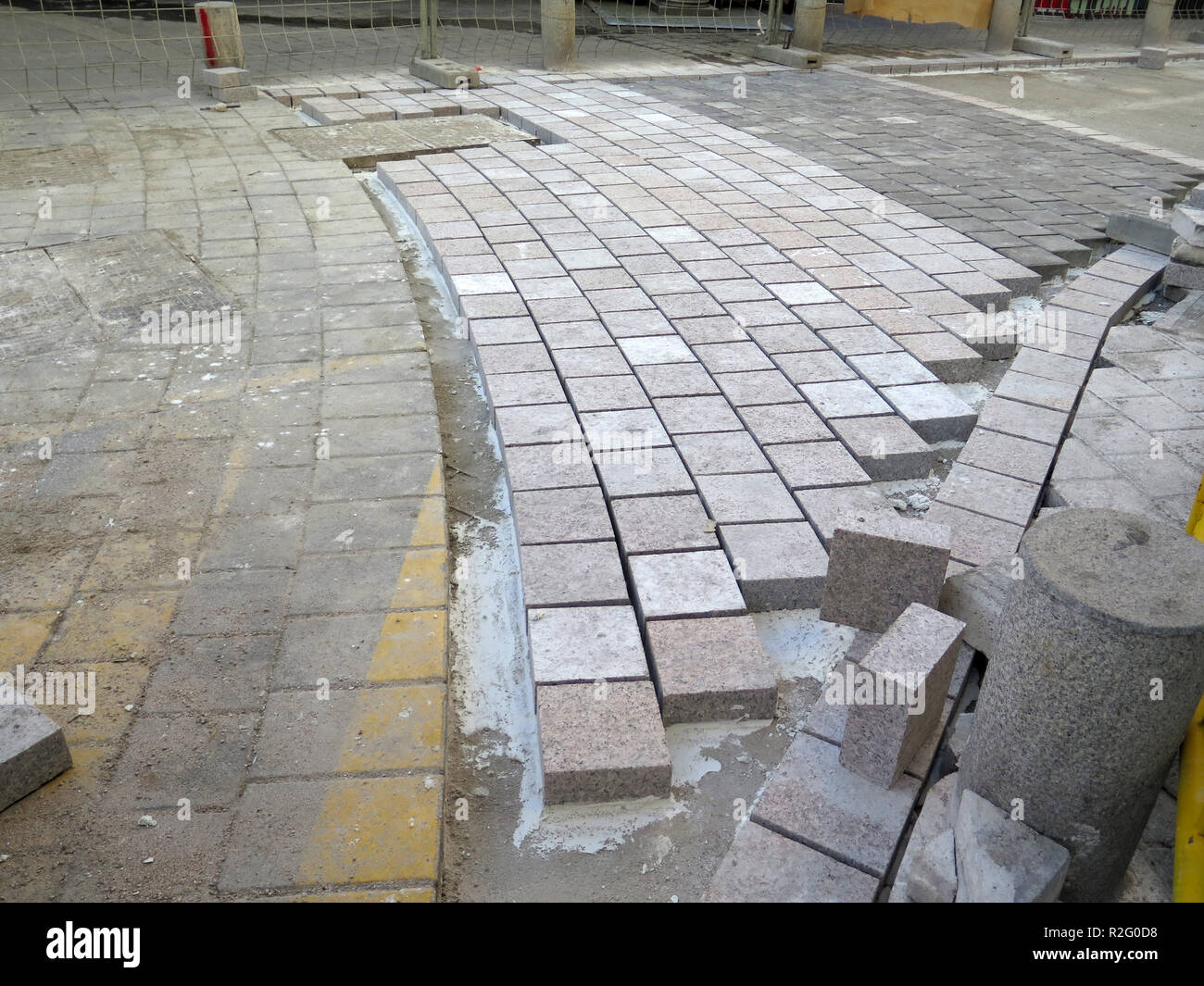 Square paving stones awaiting grouting in village street in Andalusia ...