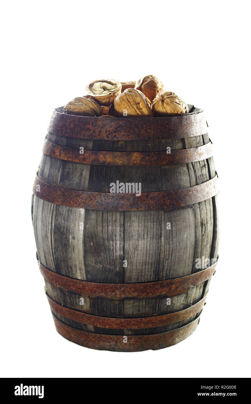 walnuts and walnut tree leaves in barrel Stock Photo - Alamy