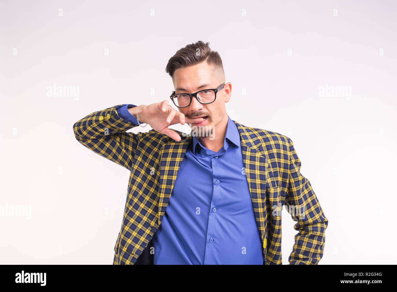 Handsome man in jacket with beard and mustache in glasses having fun ...