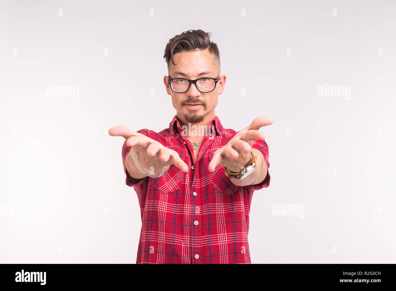 Emotion, help, people and gesture concept - young handsome man ...