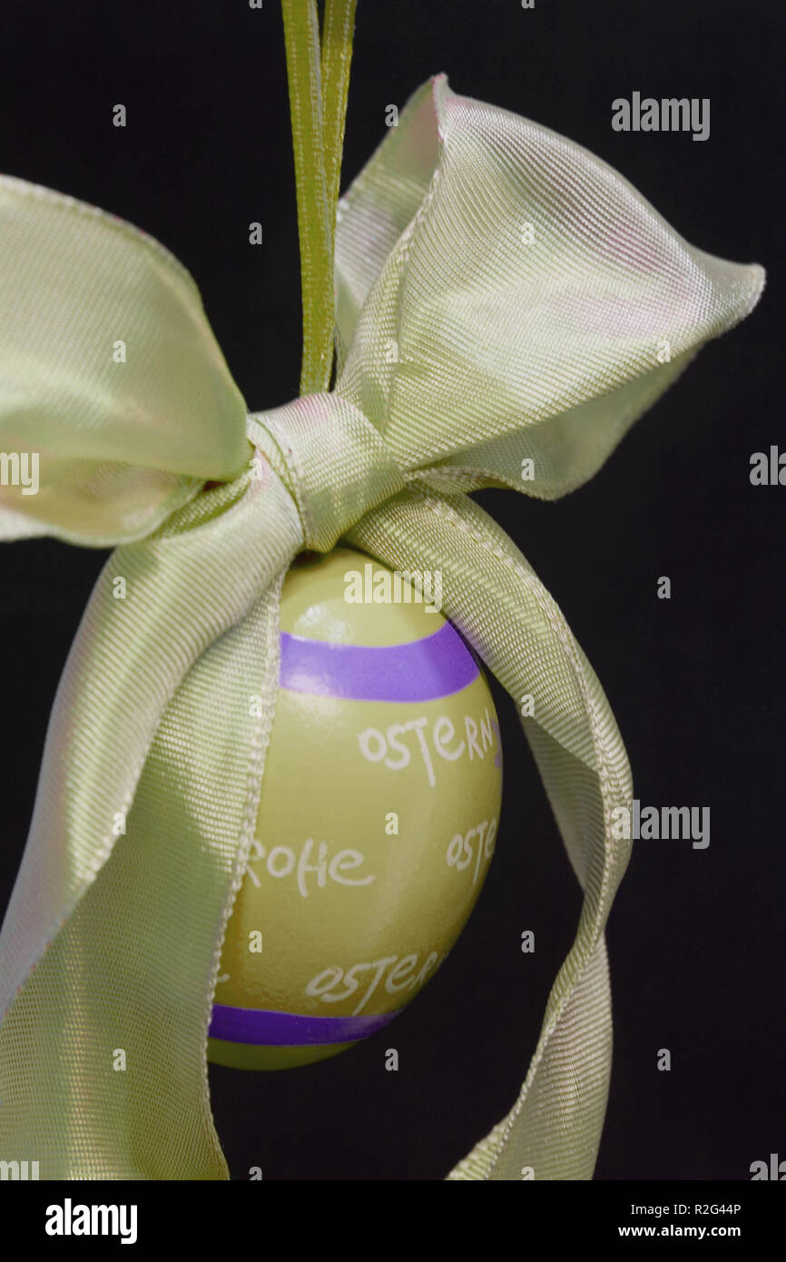 light yellow easter egg with bow Stock Photo - Alamy