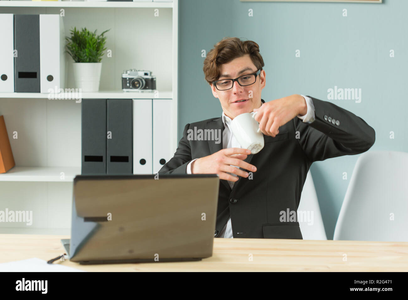 Business people, joke and fool's day concept - young funny businessman ...