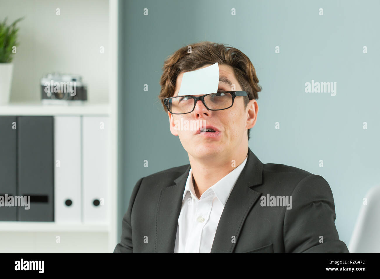 Business people, joke and fool concept - portrait of young man with ...