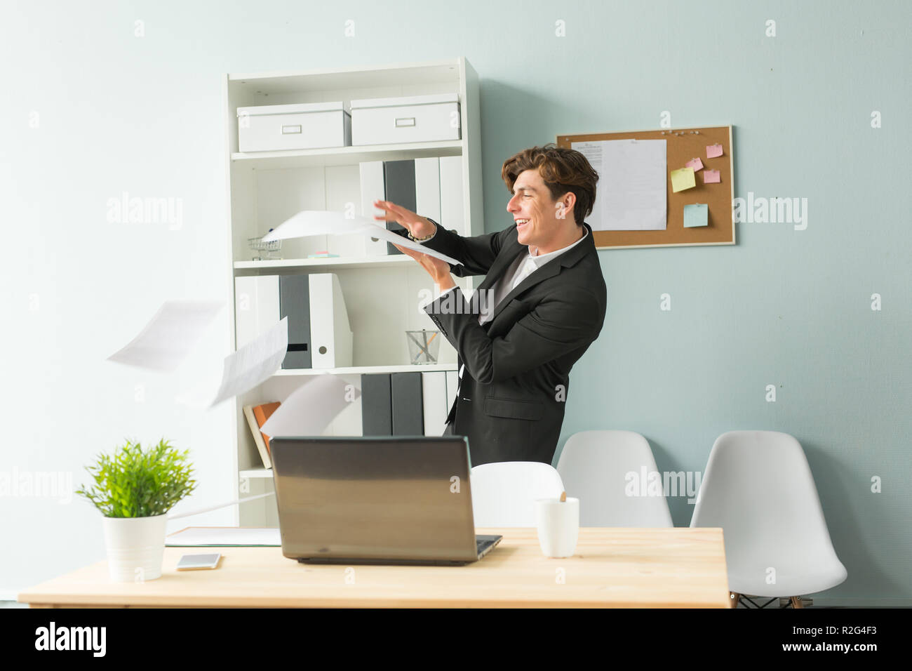 Business, joke, people concept - handsome young man in suit having fun ...