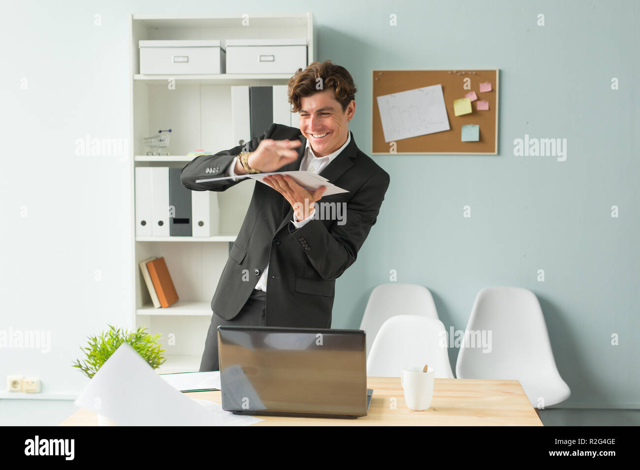 Business, joke, people concept - happy man throwing the paper because ...