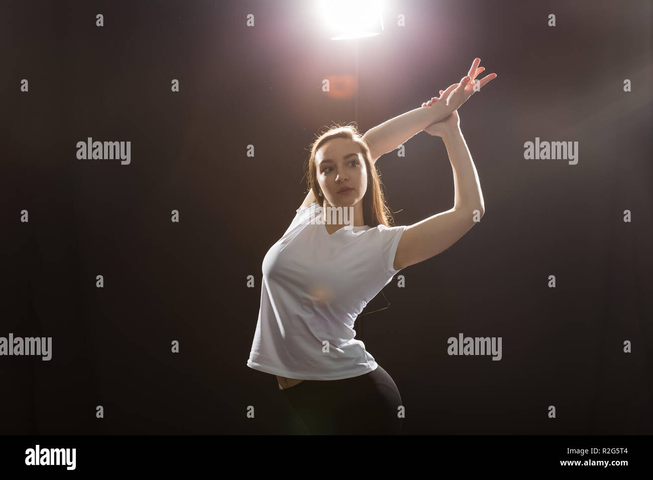 People and street dancing concept - Young fitness woman dancing jazz ...