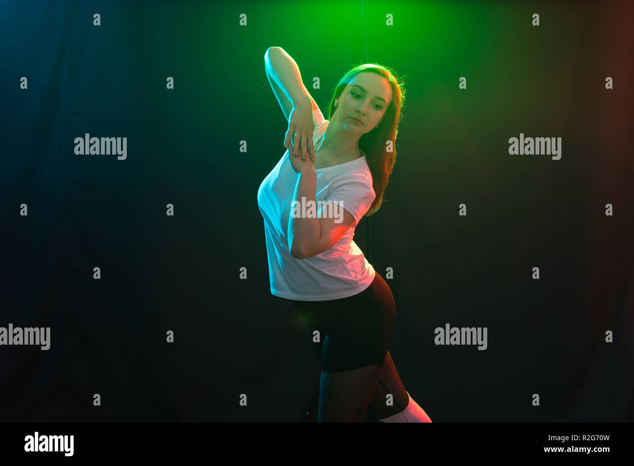 People and dancing concept - Young fitness woman dancing jazz funk over ...
