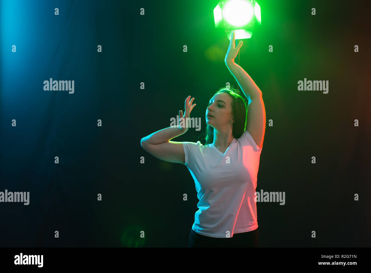People and dancing concept - Young fitness woman dancing jazz funk over ...