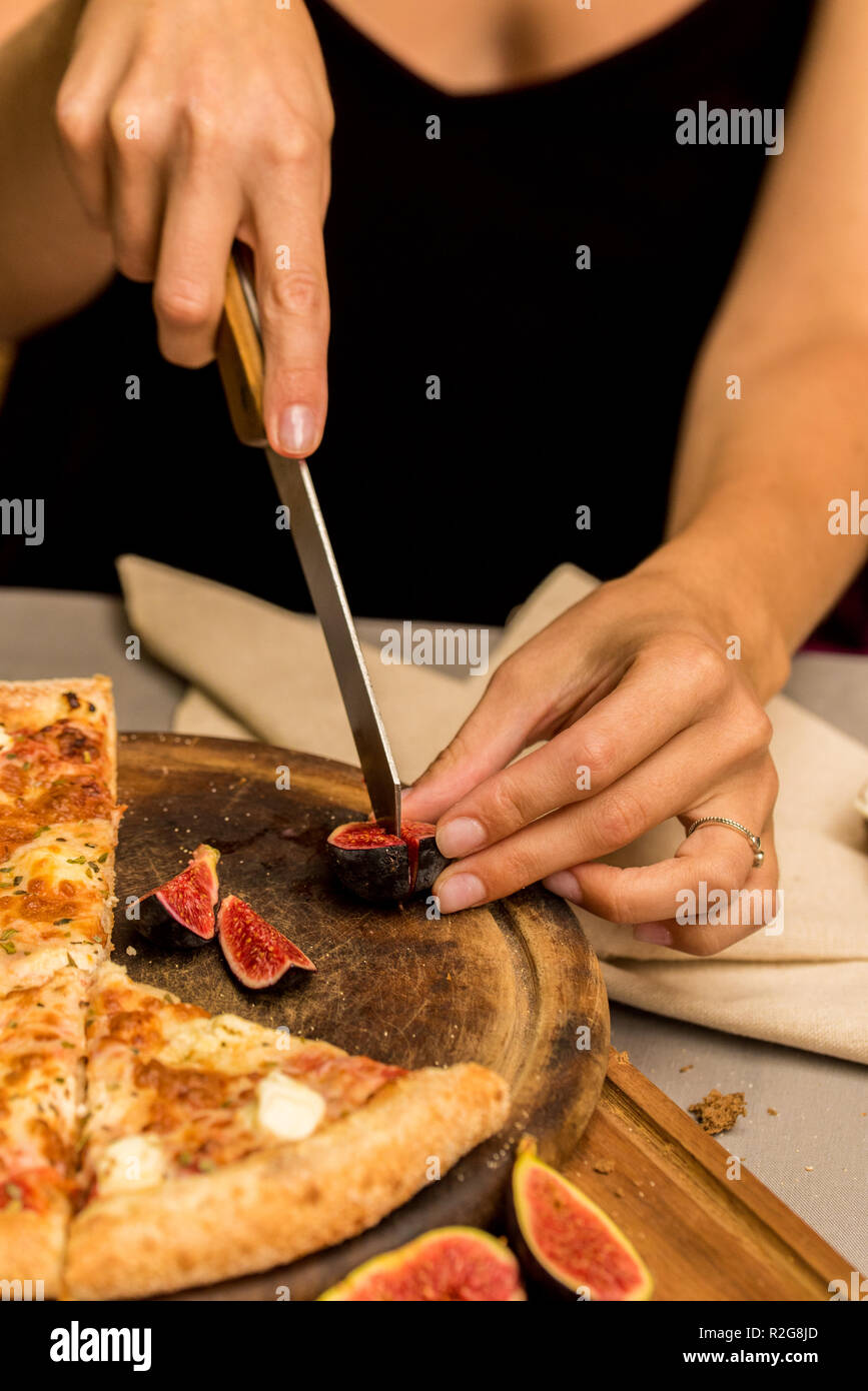 Woman cutting ripe fig table hi-res stock photography and images - Alamy
