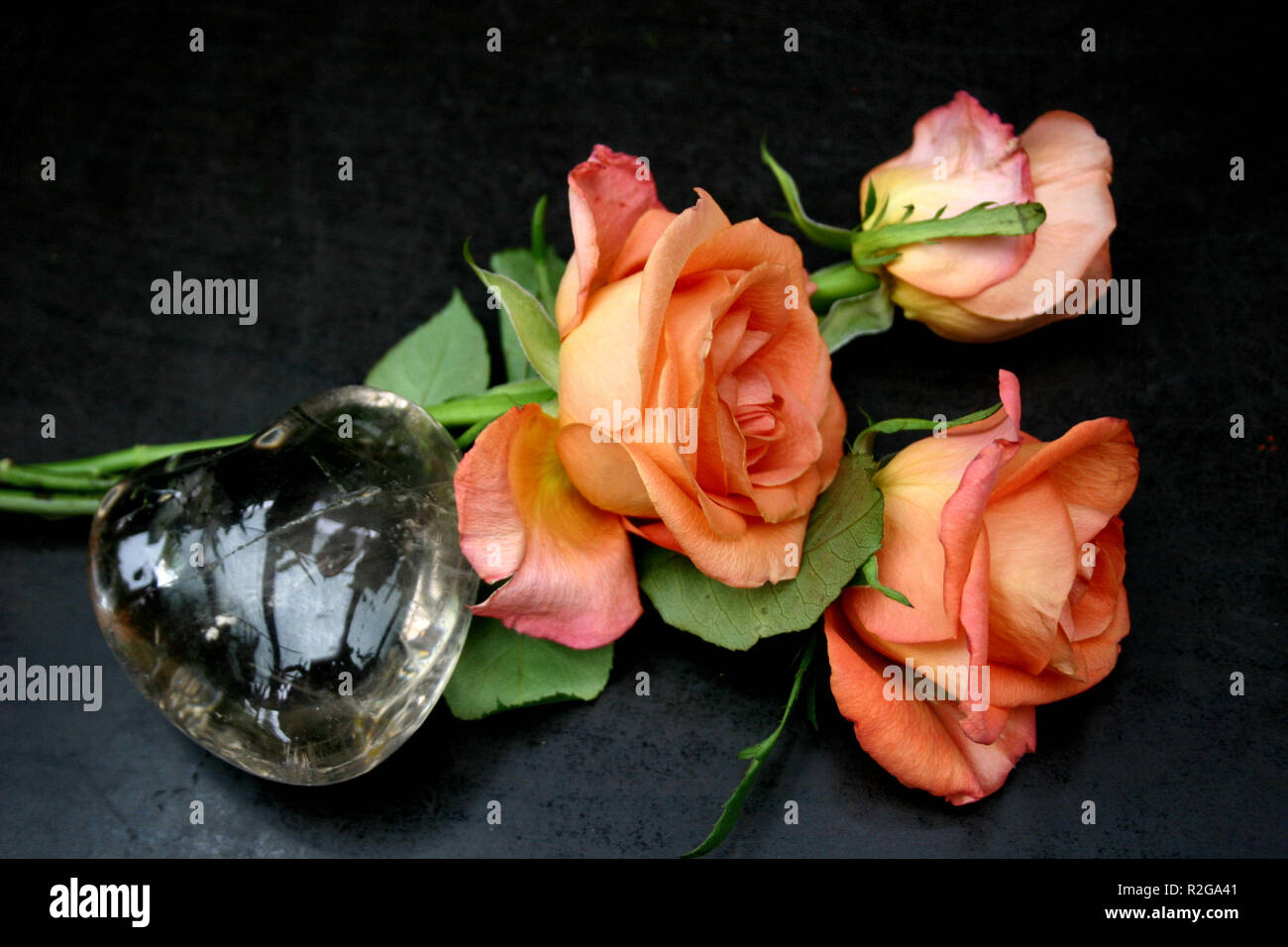 three roses and a heart Stock Photo - Alamy