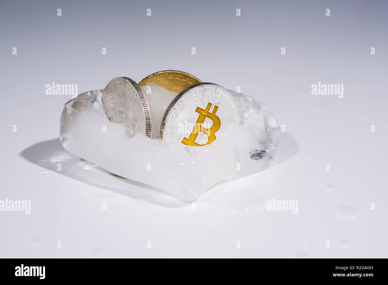 Abstract photo of cryptocurrency. Frozen coins in ice Stock Photo - Alamy