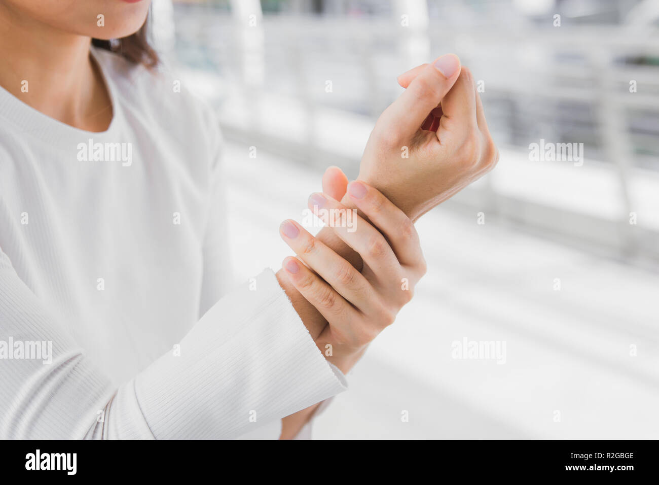 closeup business women holding rub her wrist pain from using computer ...