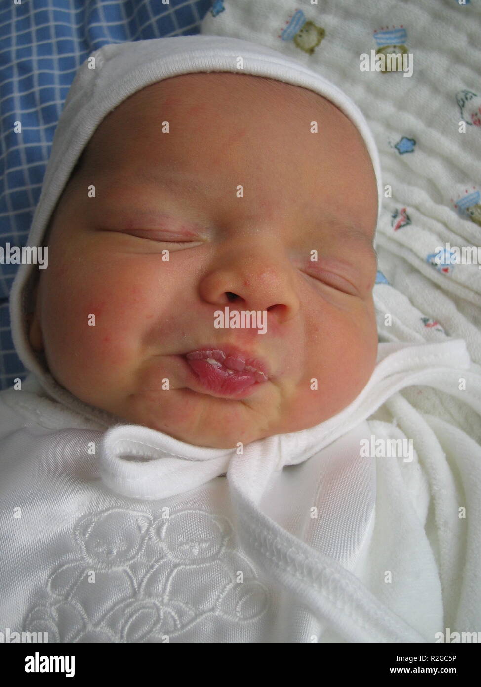 little baby sleeping with grimace Stock Photo - Alamy